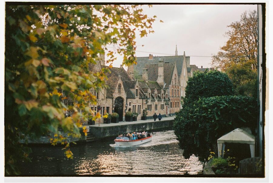 Bruges canal with reflections and greenery