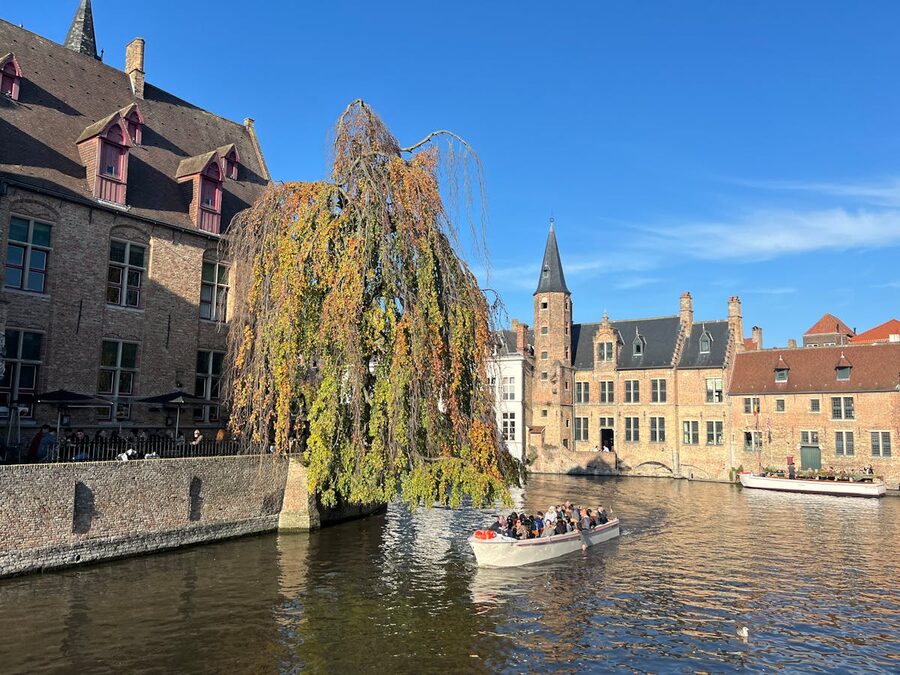 Bruges canal with boats and historic buildings