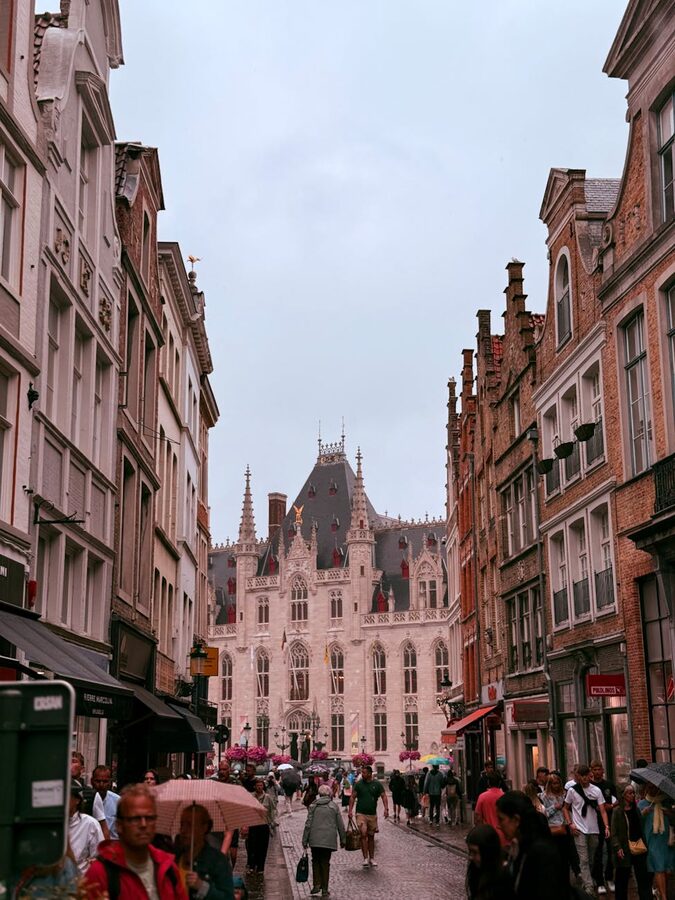 Busy street in Bruges with historic buildings
