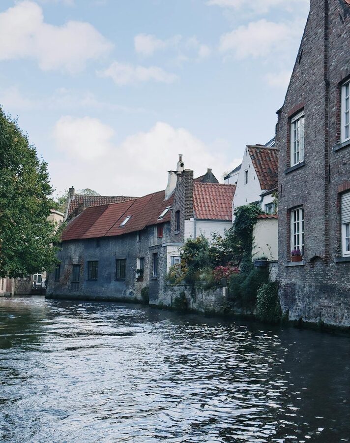 Bruges canal with Flemish architecture and calm waters