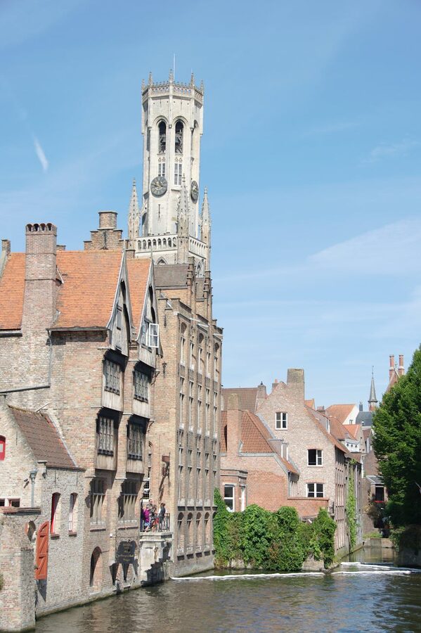 Bruges canal with medieval buildings and Belfry tower