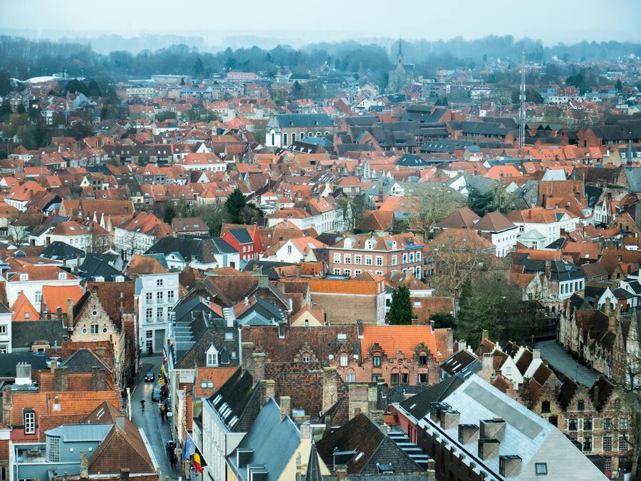 Aerial view of red-tiled rooftops in Bruges