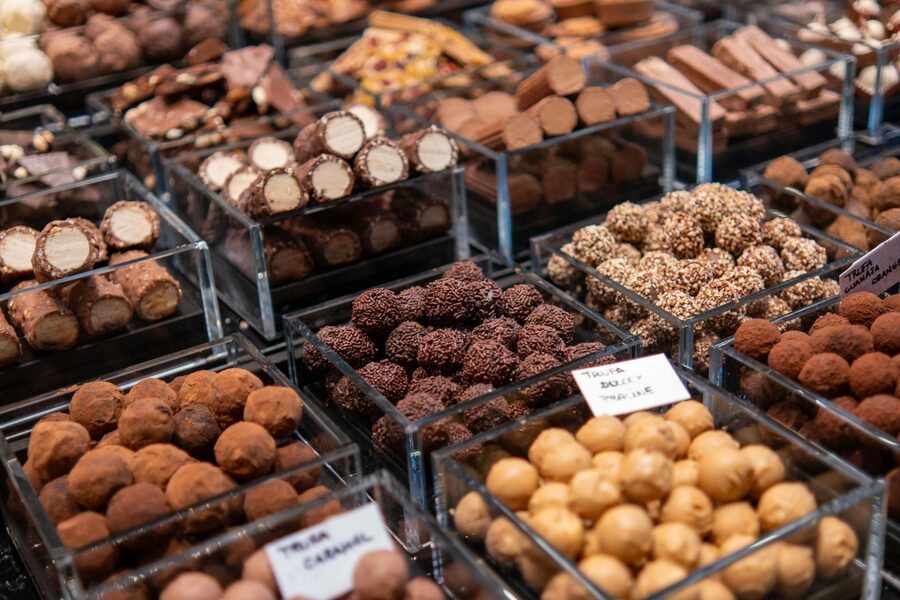 Chocolate truffles in containers at market