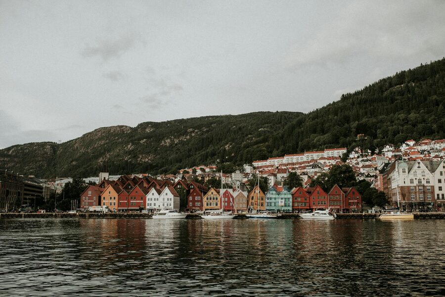 Colourful Bryggen waterfront buildings in Bergen with mountain backdrop