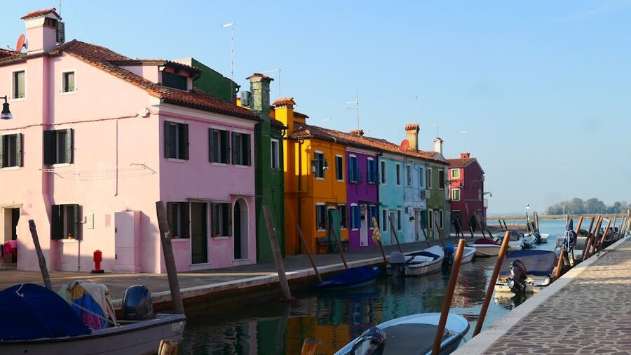Colourful houses on Burano with canal boats