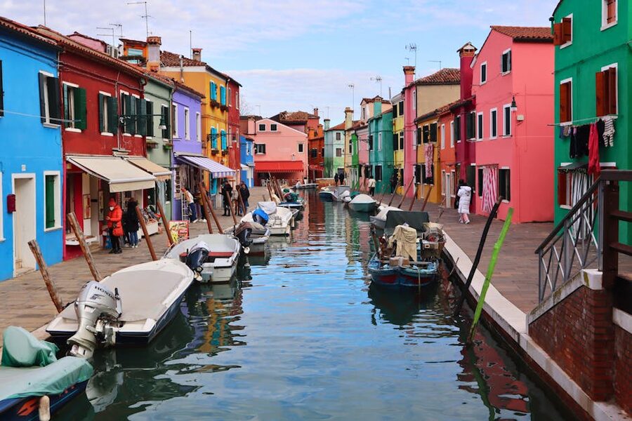 Colourful houses along a canal in Burano Venice