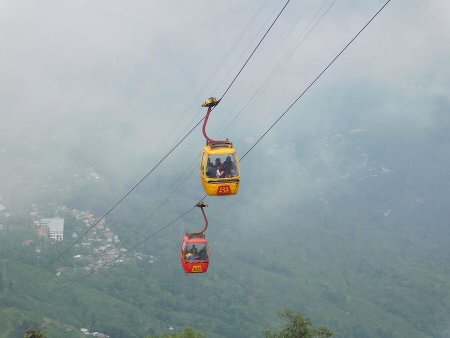 Cable car above mountain scenery