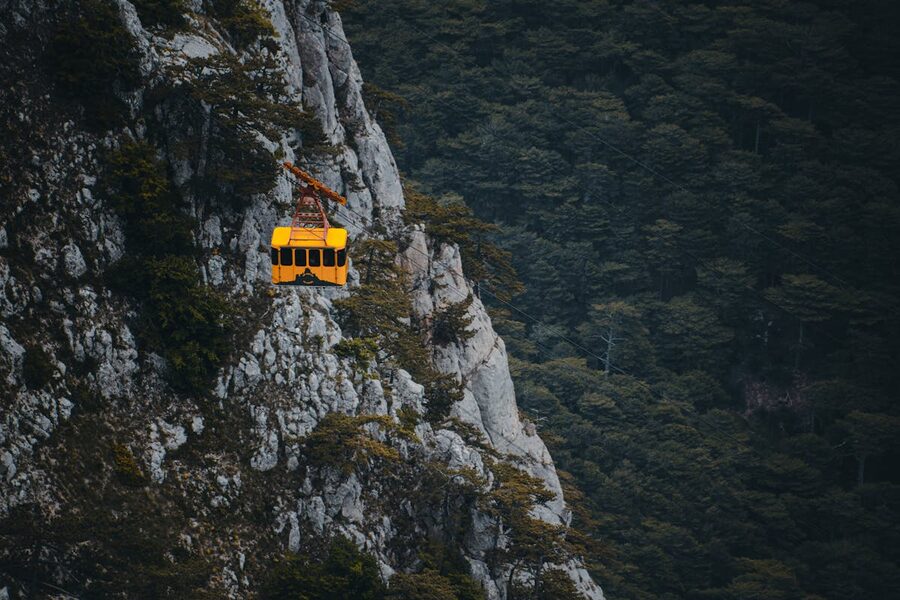Cable car gondola over mountain valley