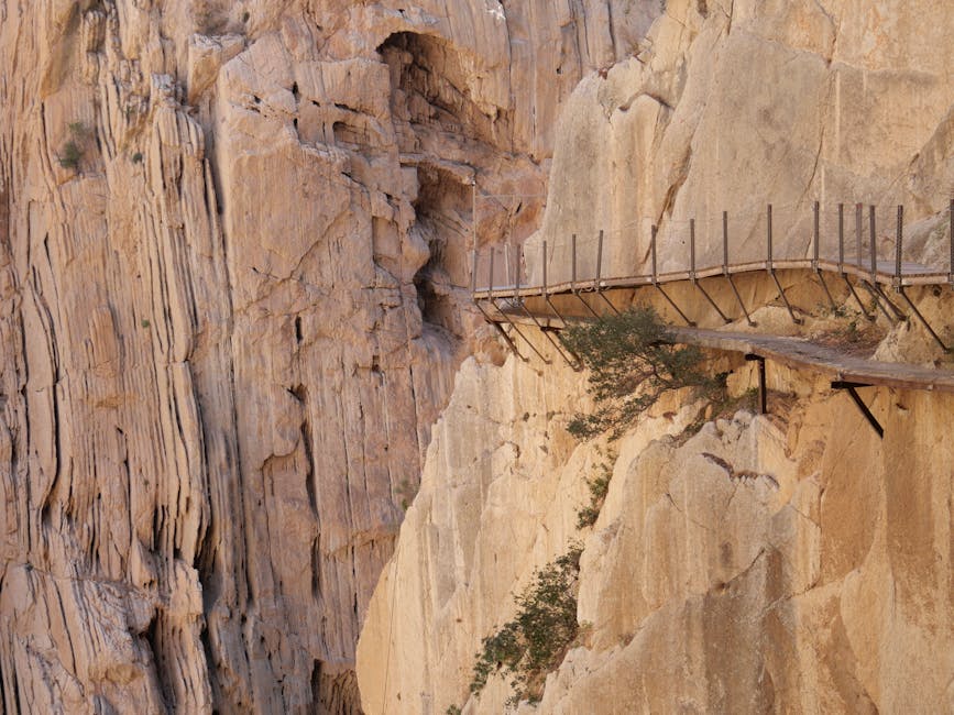 Hikers on the long cliff walkway of Caminito del Rey