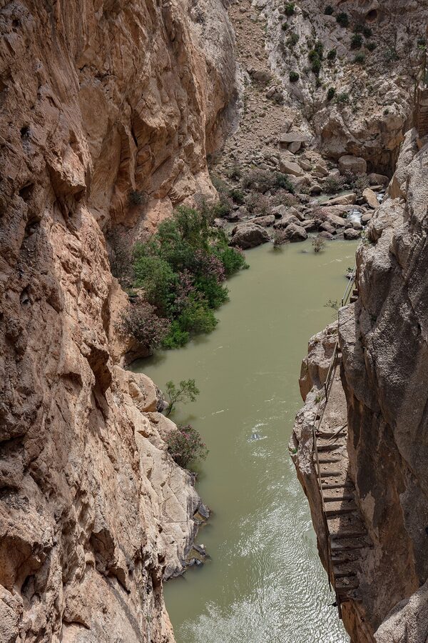 The wooden boardwalk section of Caminito del Rey bolted into the cliff face