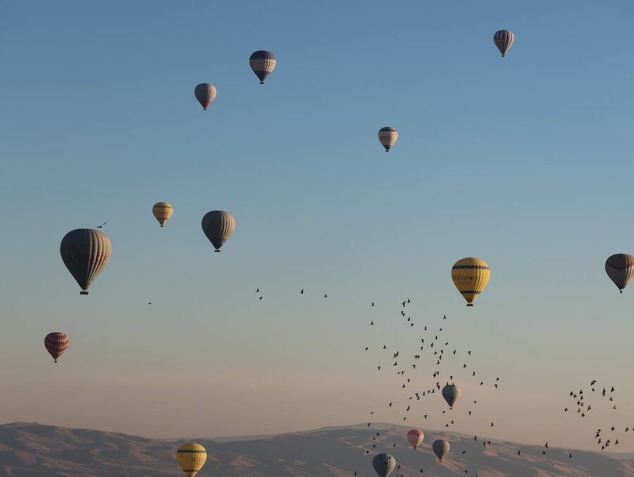 Aerial view of hot air balloons during sunrise in Cappadocia