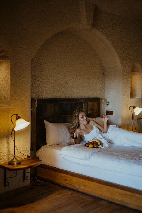Cave hotel room interior with wine and fruits in Cappadocia