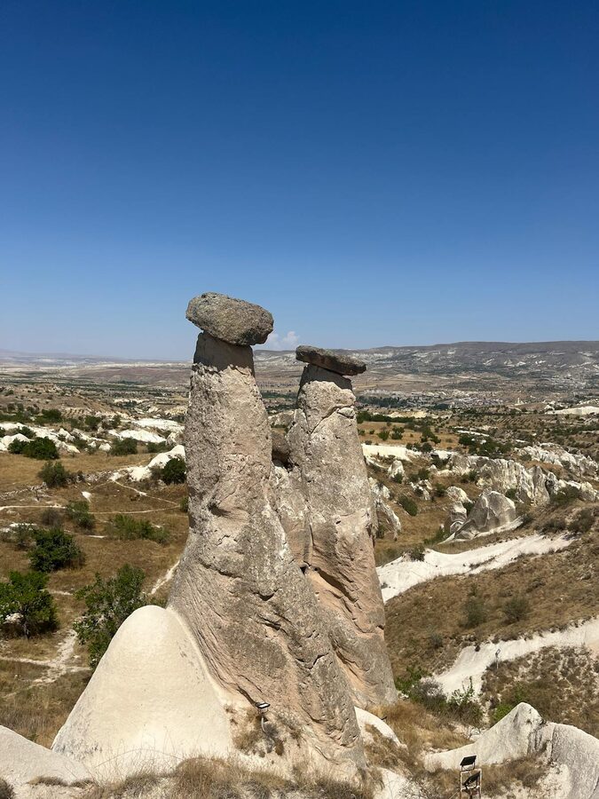 Majestic fairy chimneys under blue sky in Cappadocia