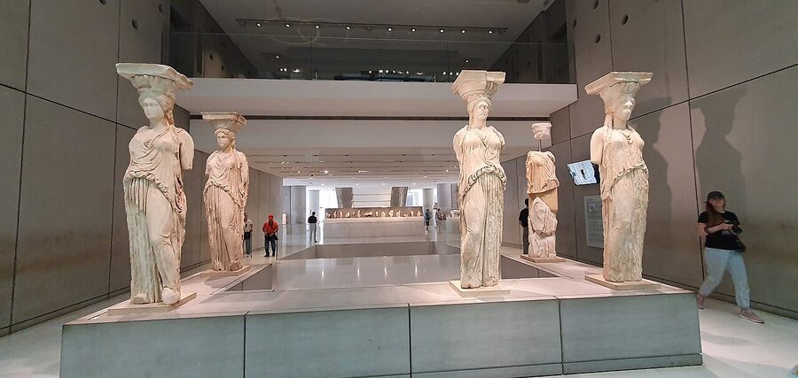 Original Caryatid statues from the Erechtheion displayed at the Acropolis Museum