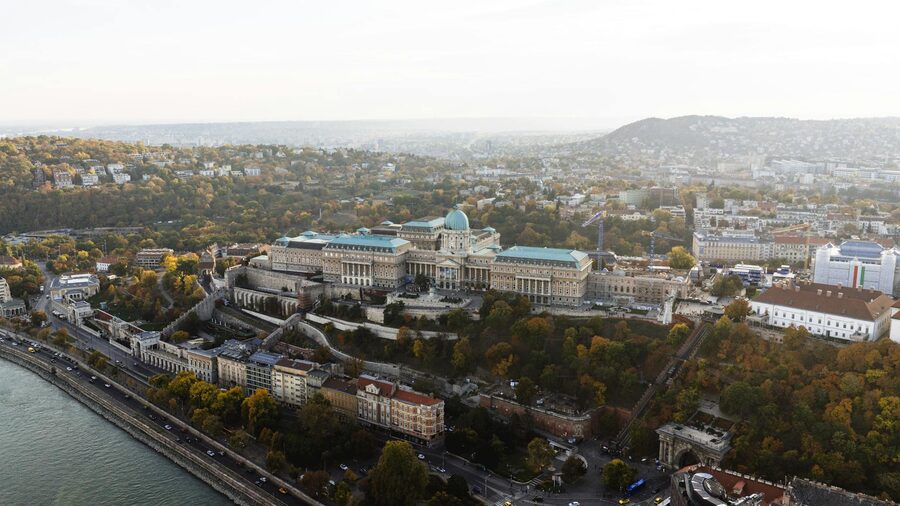 Drone shot Buda Castle overlooking Danube