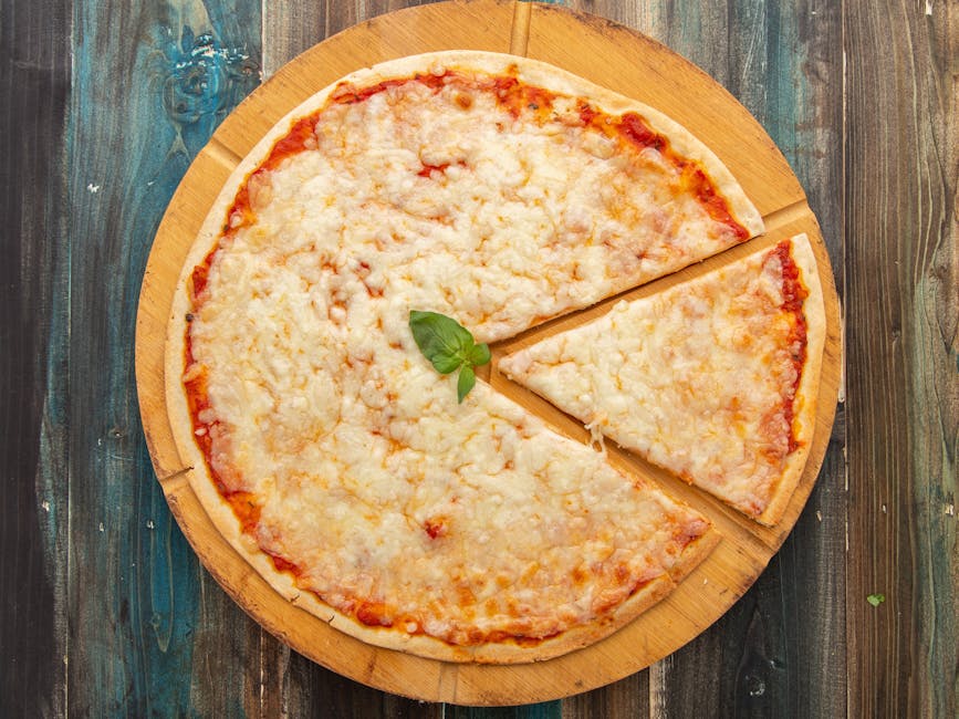 Cheese pizza on wooden cutting board