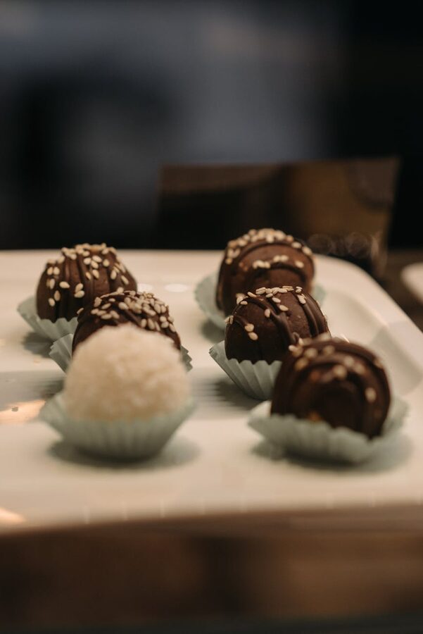 Chocolate truffles with sesame seeds in cupcake liners