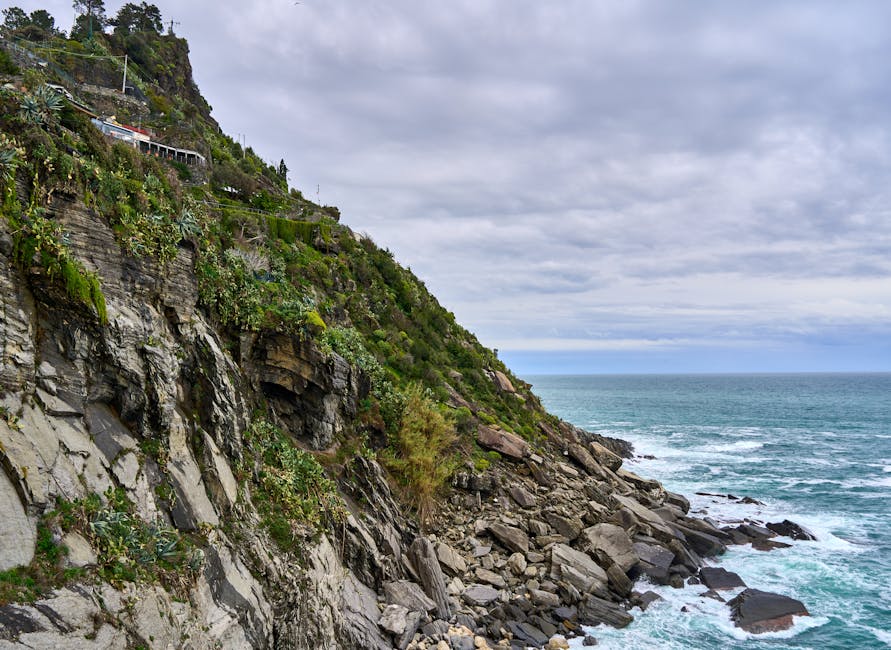 Cinque Terre green cliffside meeting the Mediterranean sea