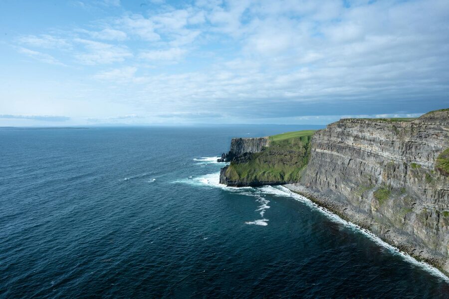 Aerial view of the Cliffs of Moher stretching along the Irish coast