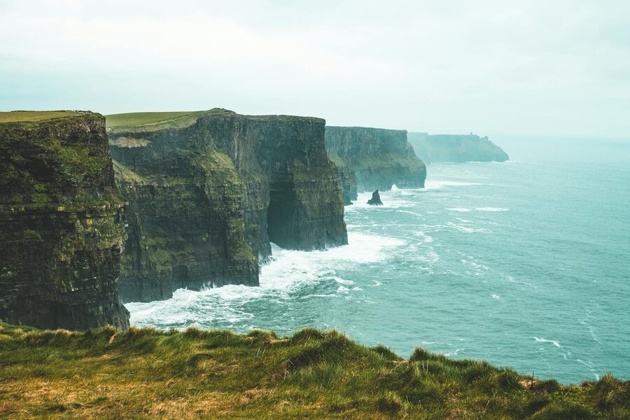 Dramatic cliff face at the Cliffs of Moher under overcast sky