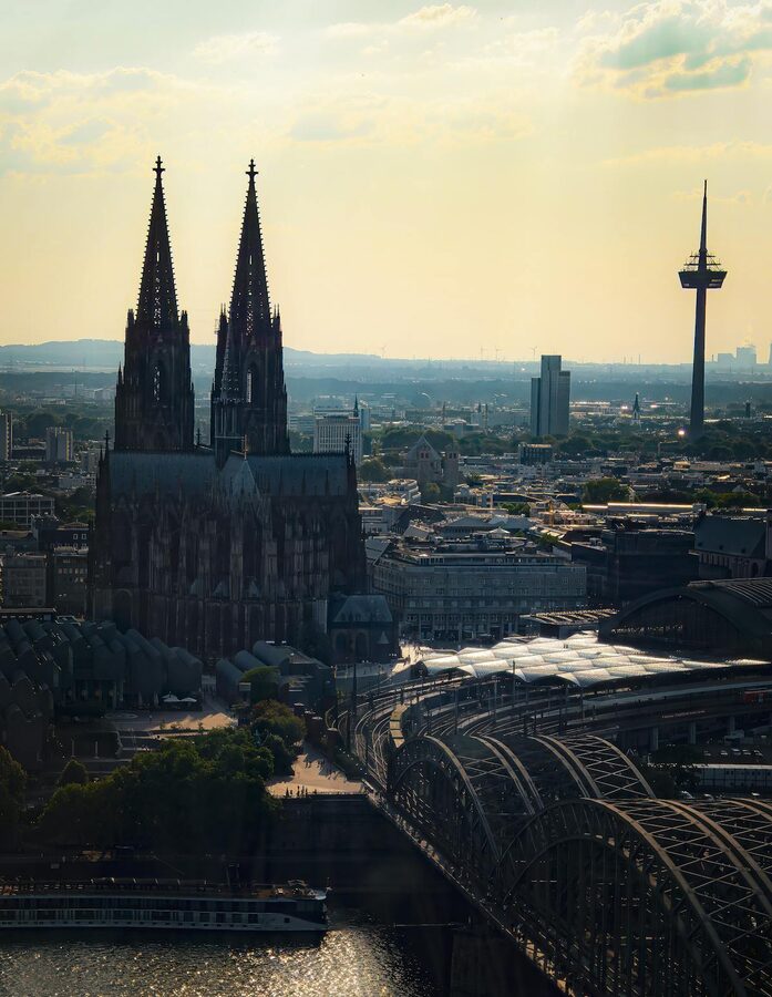 Aerial view of Cologne Cathedral and Hohenzollern Bridge along Rhine River