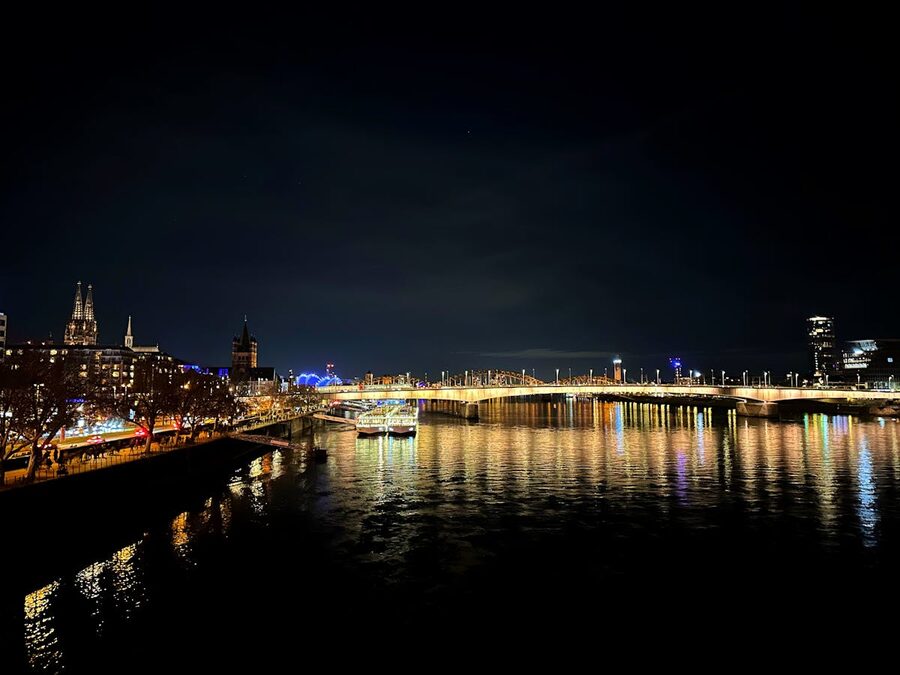 Cologne city lights reflecting on Rhine River at night