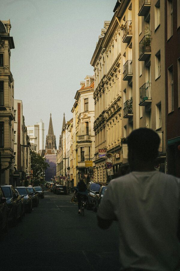 Cologne street view with cathedral towers rising above city buildings