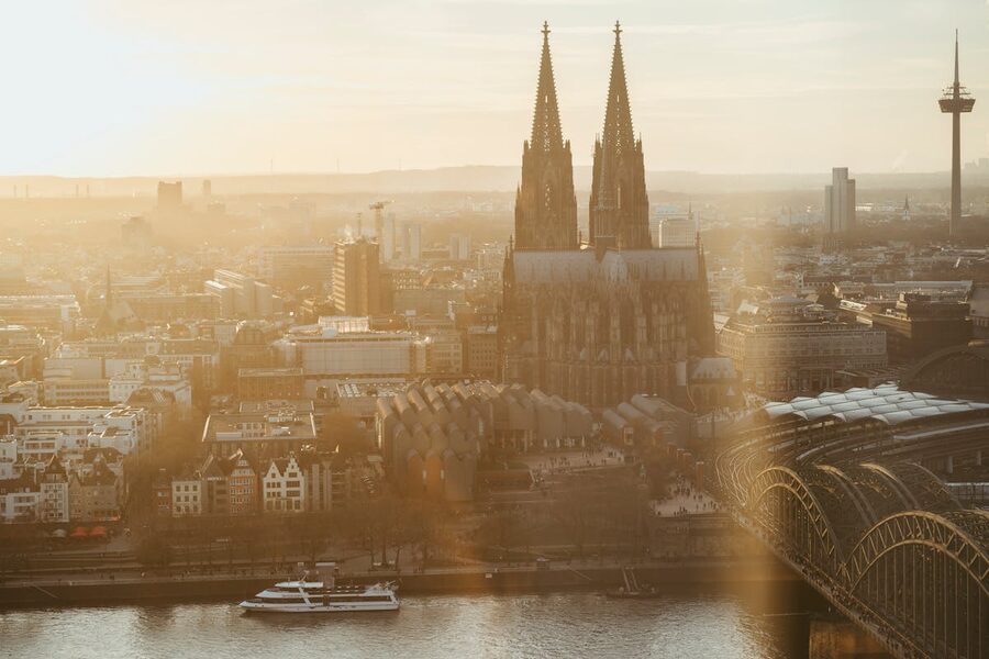 Golden sunrise aerial view of Cologne Cathedral over Rhine River