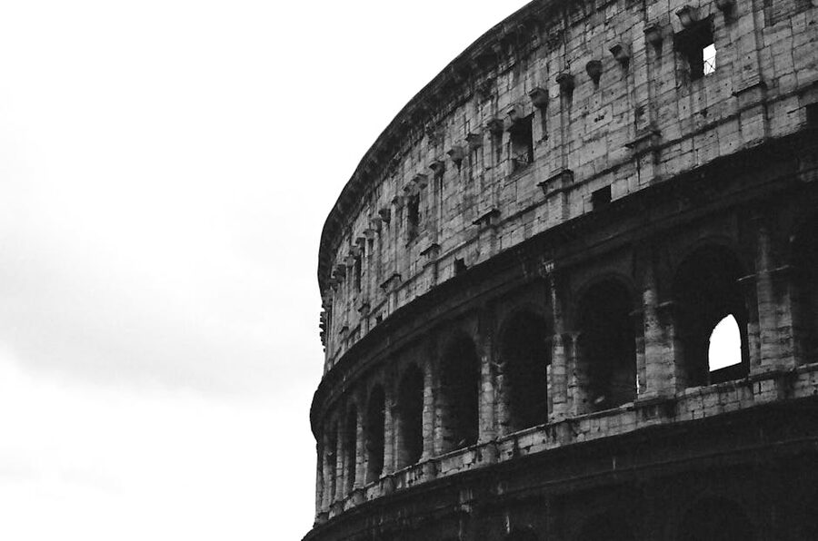 Colosseum in black and white showing ancient Roman architecture