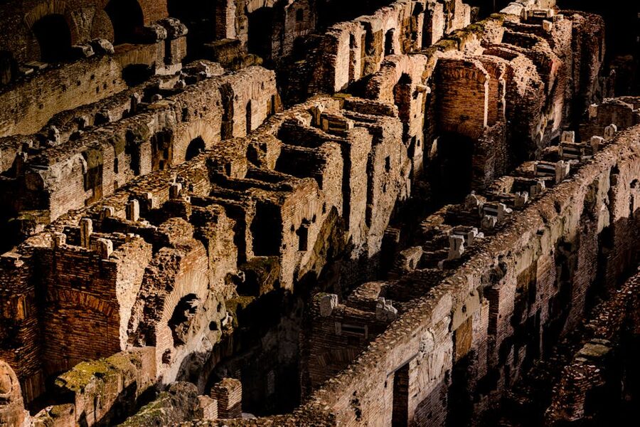 Colosseum ruins at dusk showing ancient Roman architecture