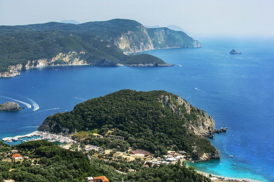 Aerial view of the Corfu Ionian coast with buildings on rocky seashore