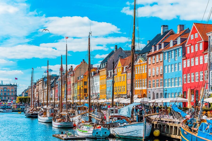 Wide angle view of Nyhavn canal with boats and colourful buildings