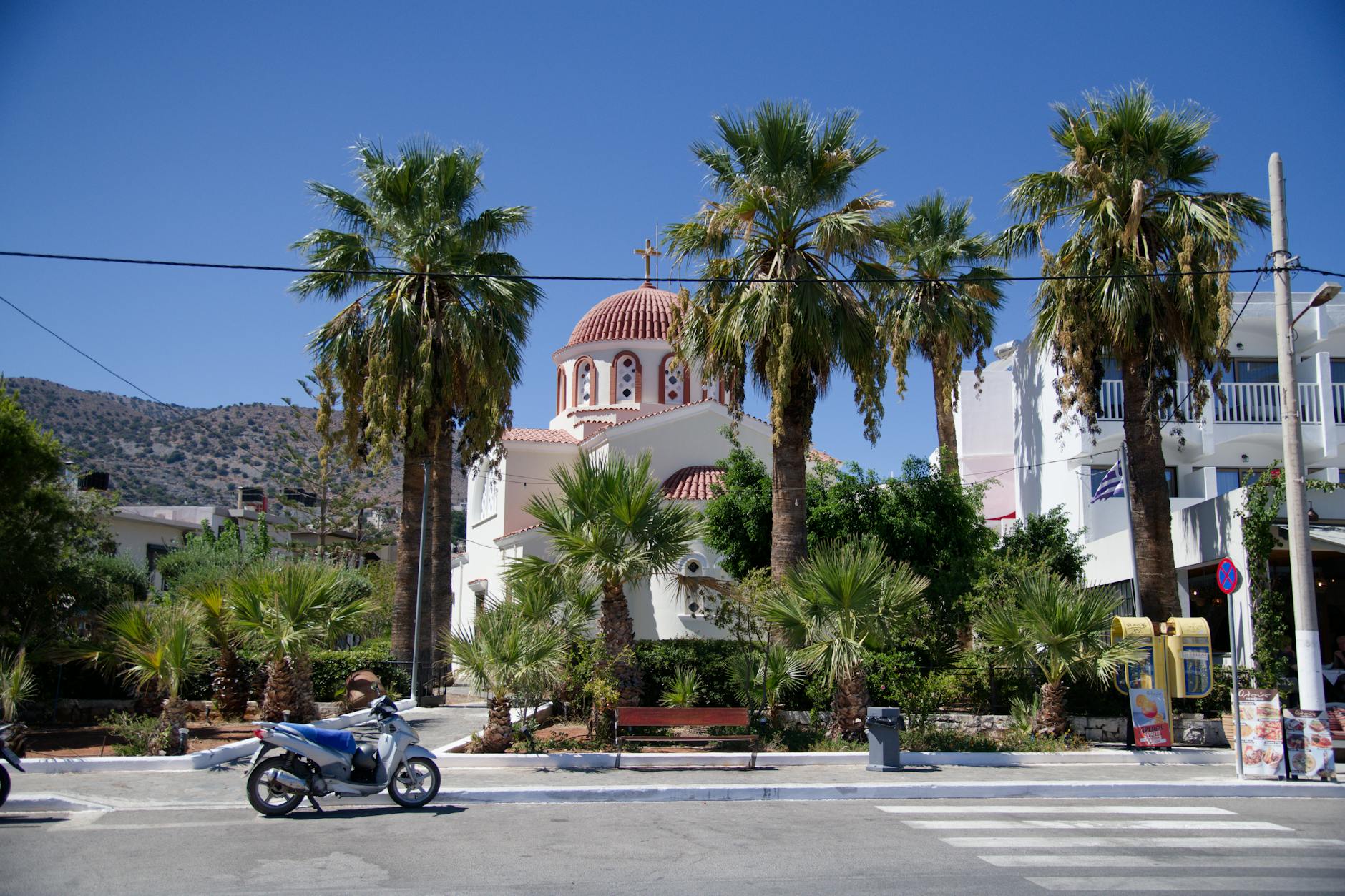 Greek church with palm trees in Crete