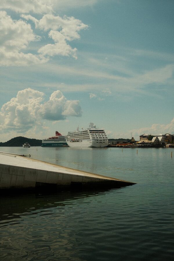 Cruise ships docked at Oslo fjord harbour with blue skies