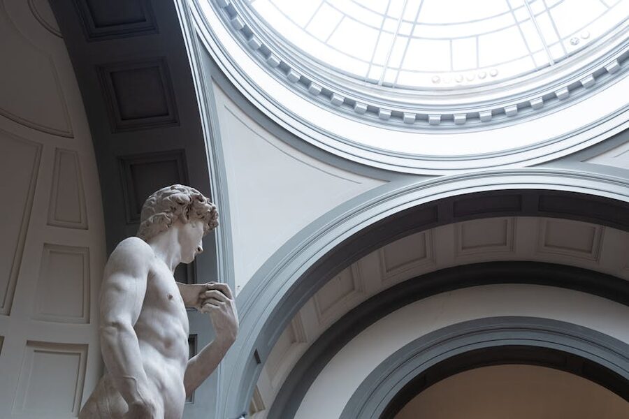 Side view of Michelangelo's David inside the Accademia