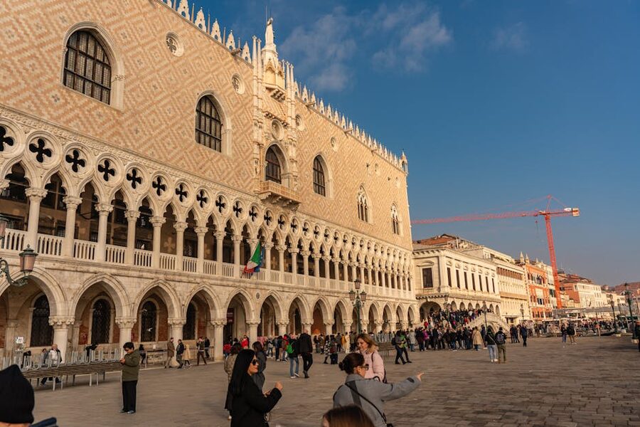 Tourists exploring the Doges Palace Venice on a sunny day