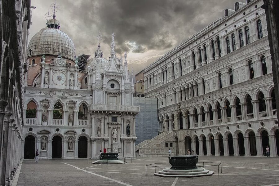 Doges Palace courtyard under dramatic skies in Venice