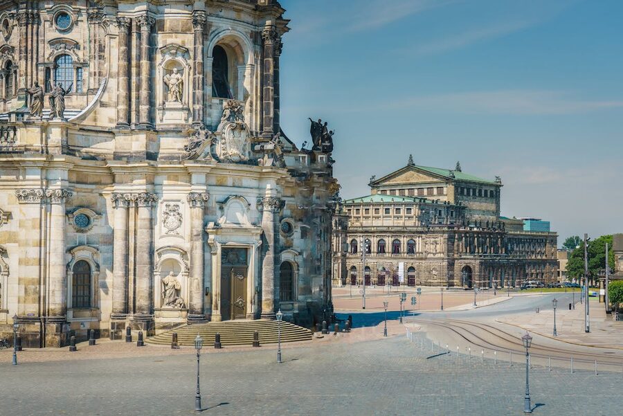 Semperoper and Hofkirche buildings under clear blue sky in Dresden