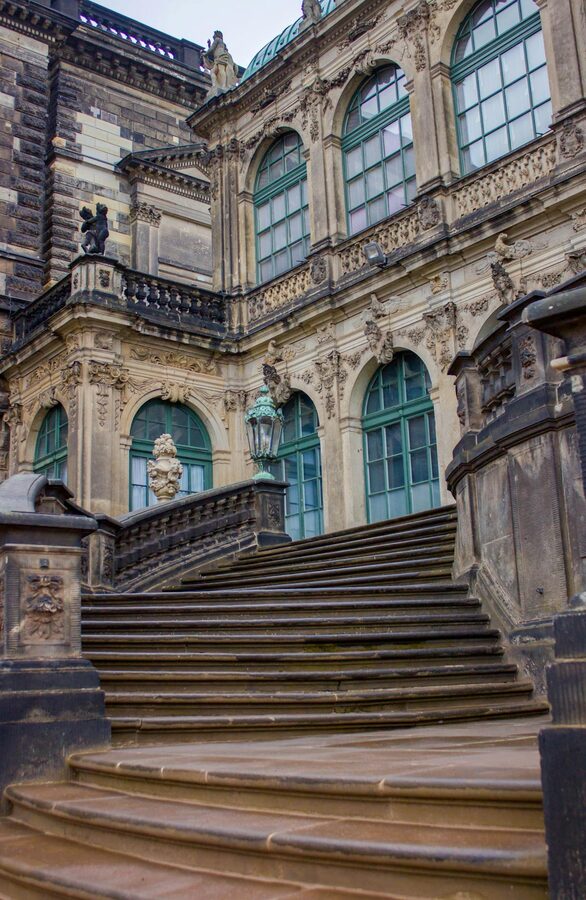 Elegant exterior staircase of Zwinger Palace in Dresden showing Baroque architecture