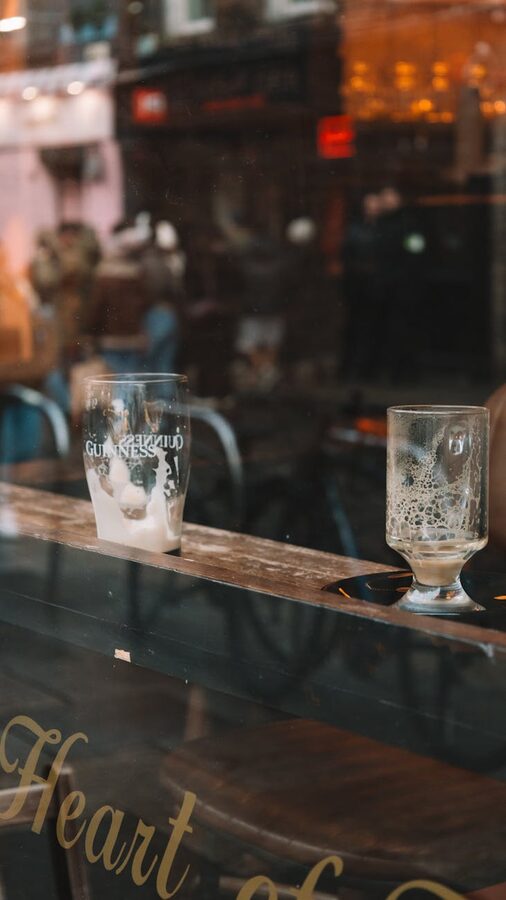 Empty beer glasses on a window sill in a cozy Dublin bar