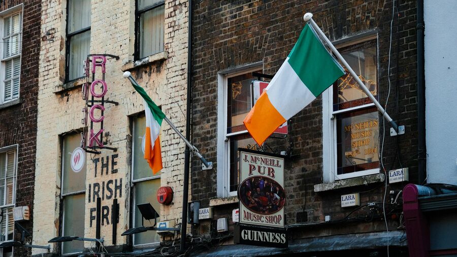Exterior of an Irish pub in Dublin with flags and signage