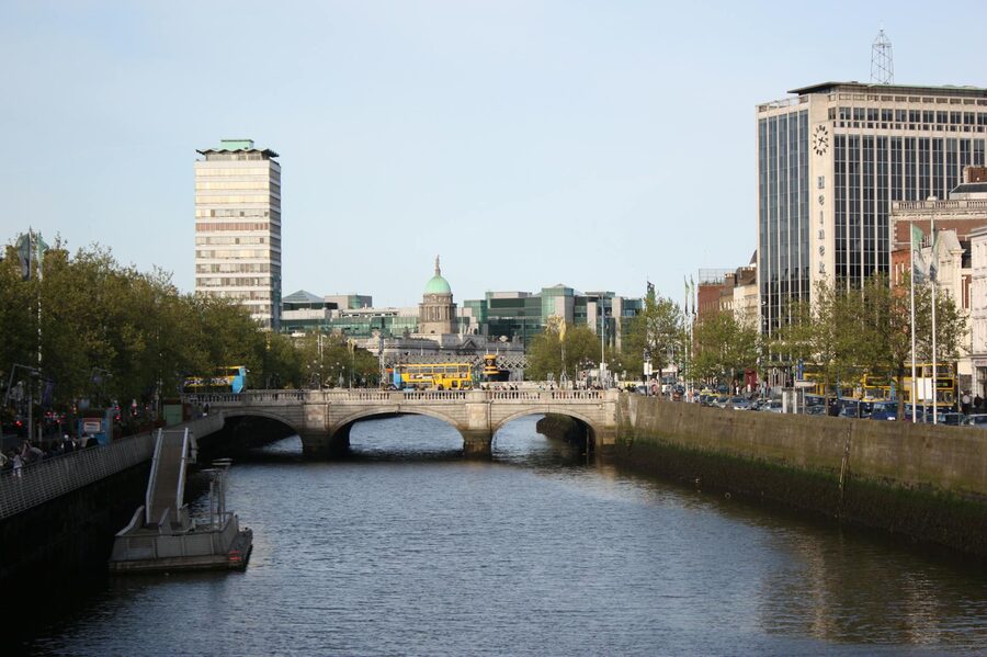 O'Connell Bridge on a sunny day with traffic crossing the River Liffey