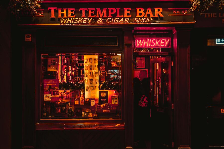 Temple Bar pub in Dublin lit up at night with warm glow