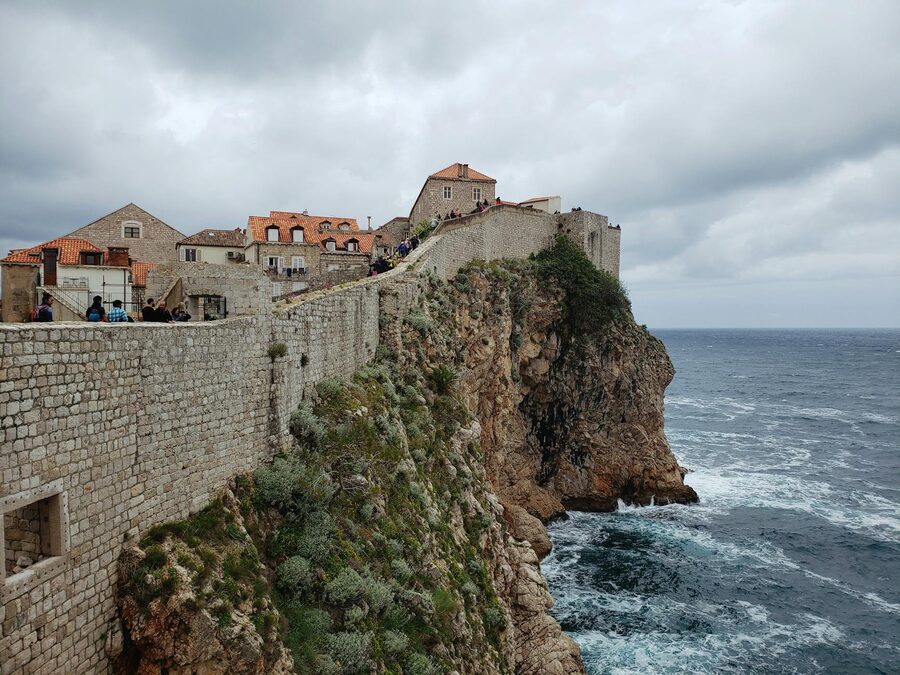 Dubrovnik city wall on cliff above Adriatic