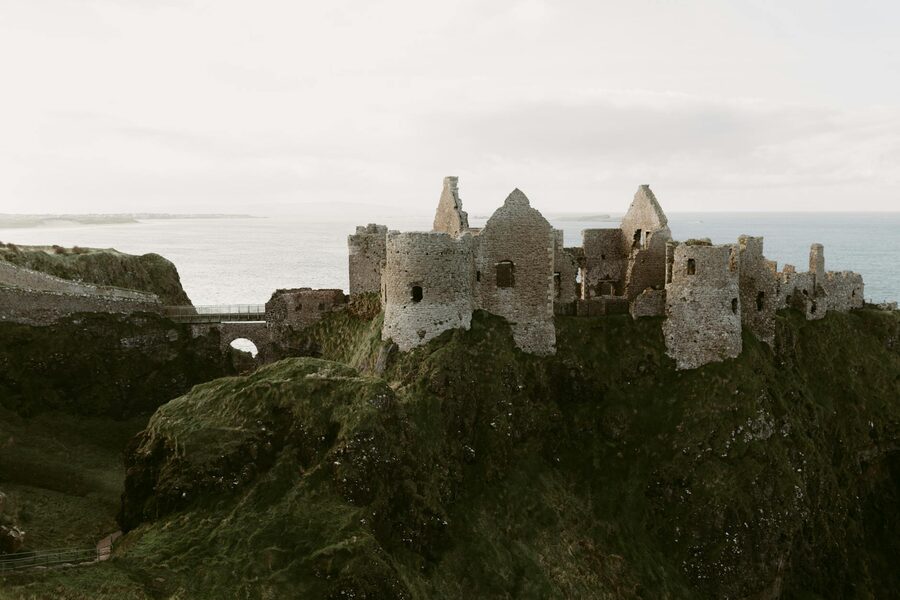 Dunluce Castle ruins perched on cliffs overlooking the sea in Northern Ireland