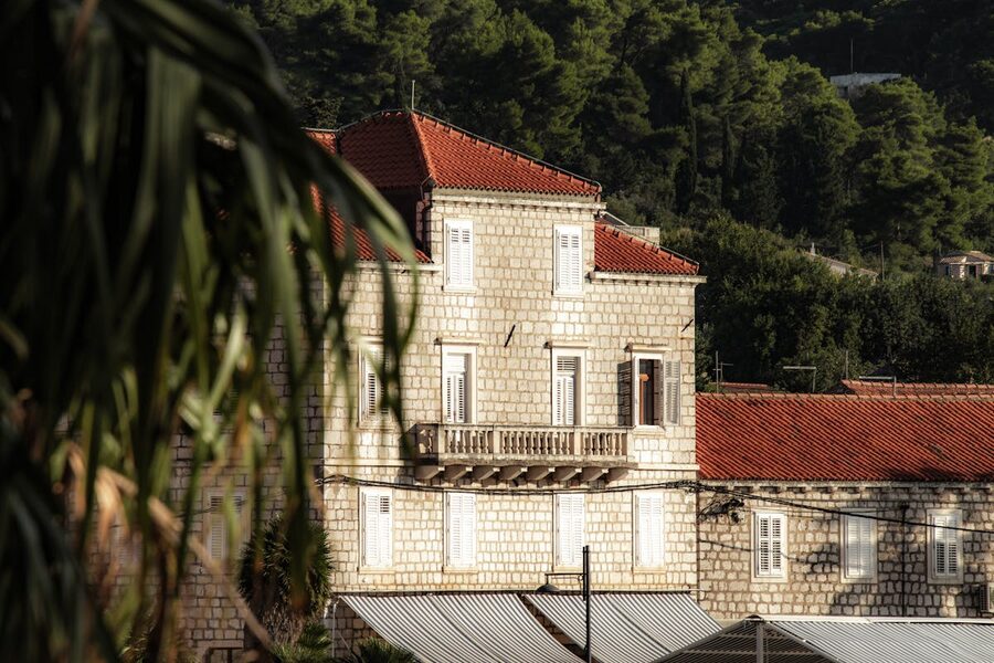 Stone building with red rooftops in Lopud island Croatia
