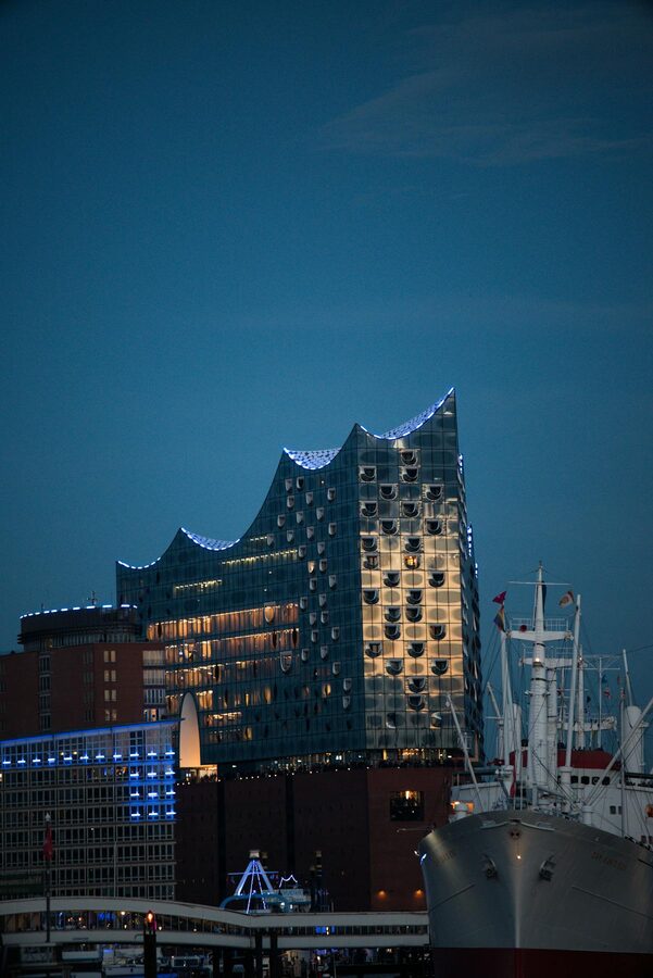 Elbphilharmonie illuminated at night against the evening sky in Hamburg