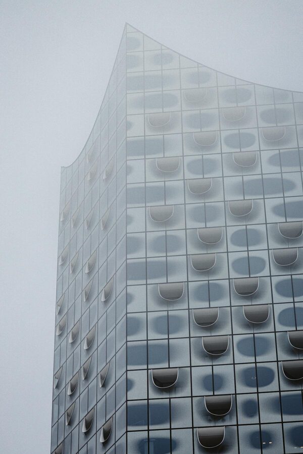 Elbphilharmonie partially hidden by fog rolling in from the Elbe River