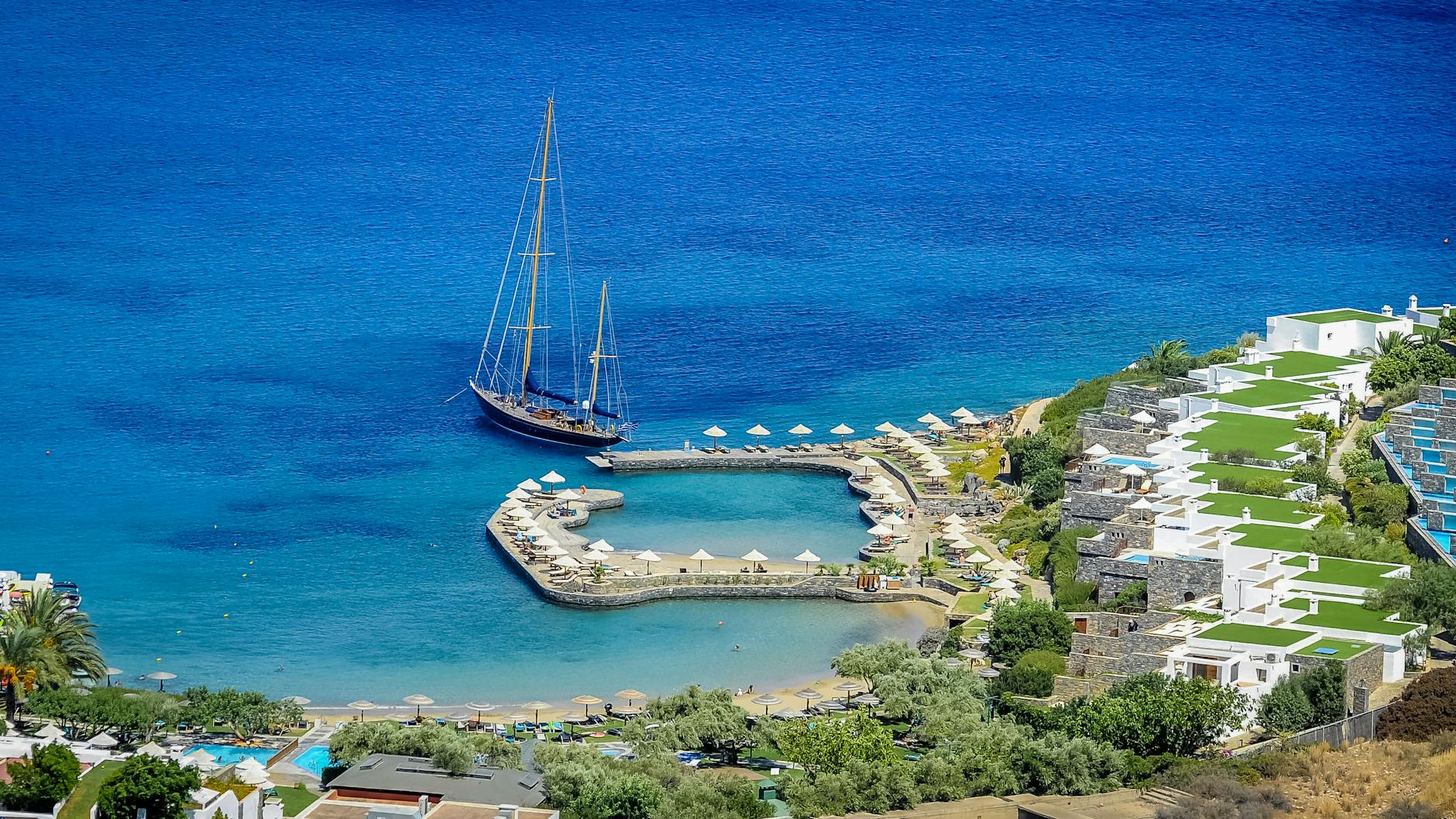 Elounda marina with luxury yacht and resort views