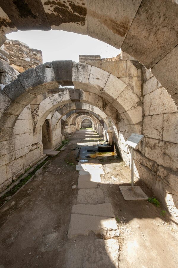 Stone arched corridors in an ancient Agora near Ephesus